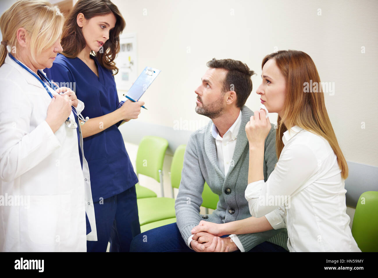 Medical team explaining results to patients relatives Stock Photo - Alamy