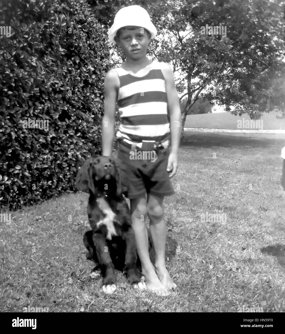 JOHN F. KENNEDY (1917-1963) with his dog Bobby at Hyannisport ...