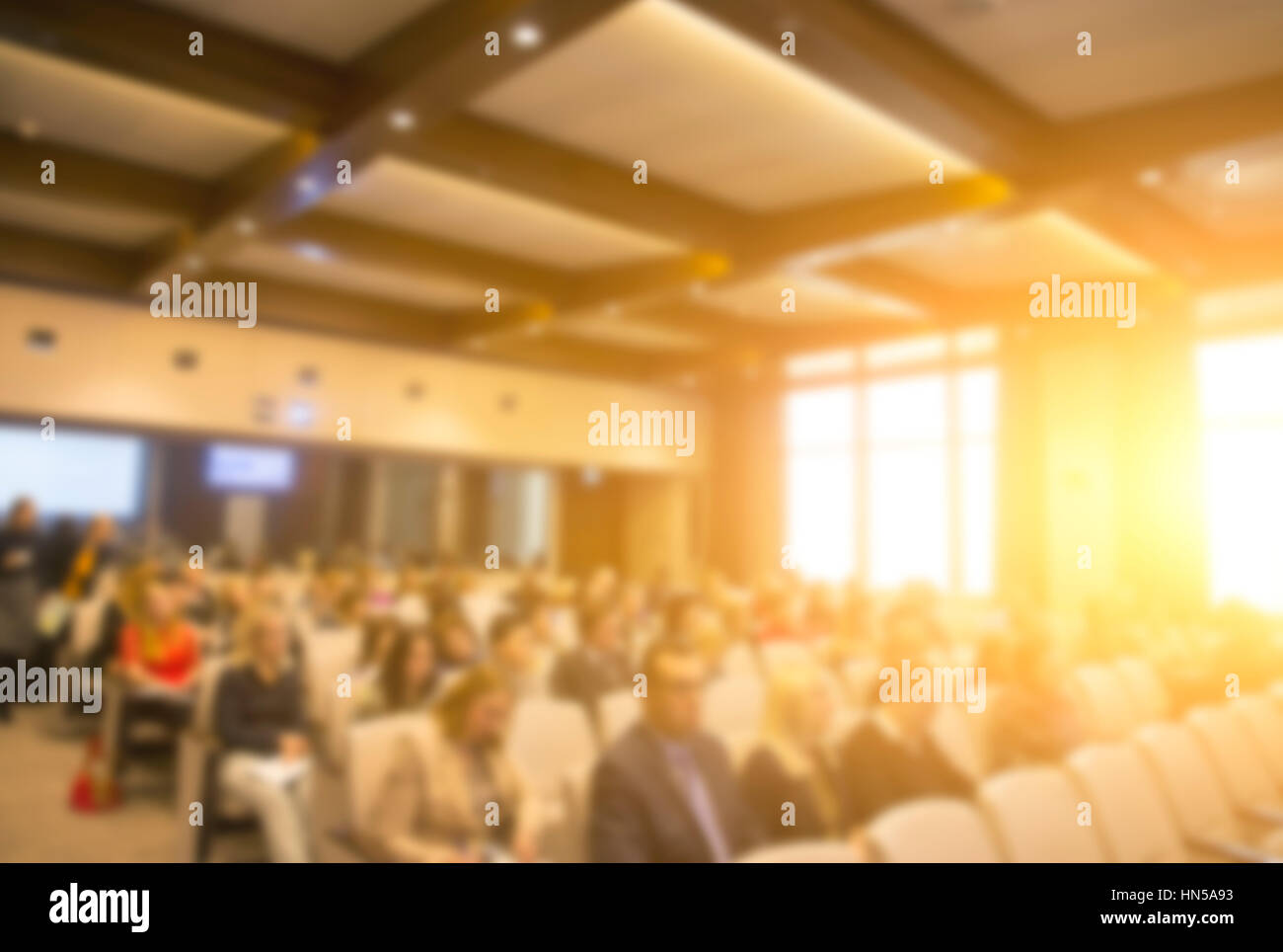 People sitting in conference hall Stock Photo - Alamy