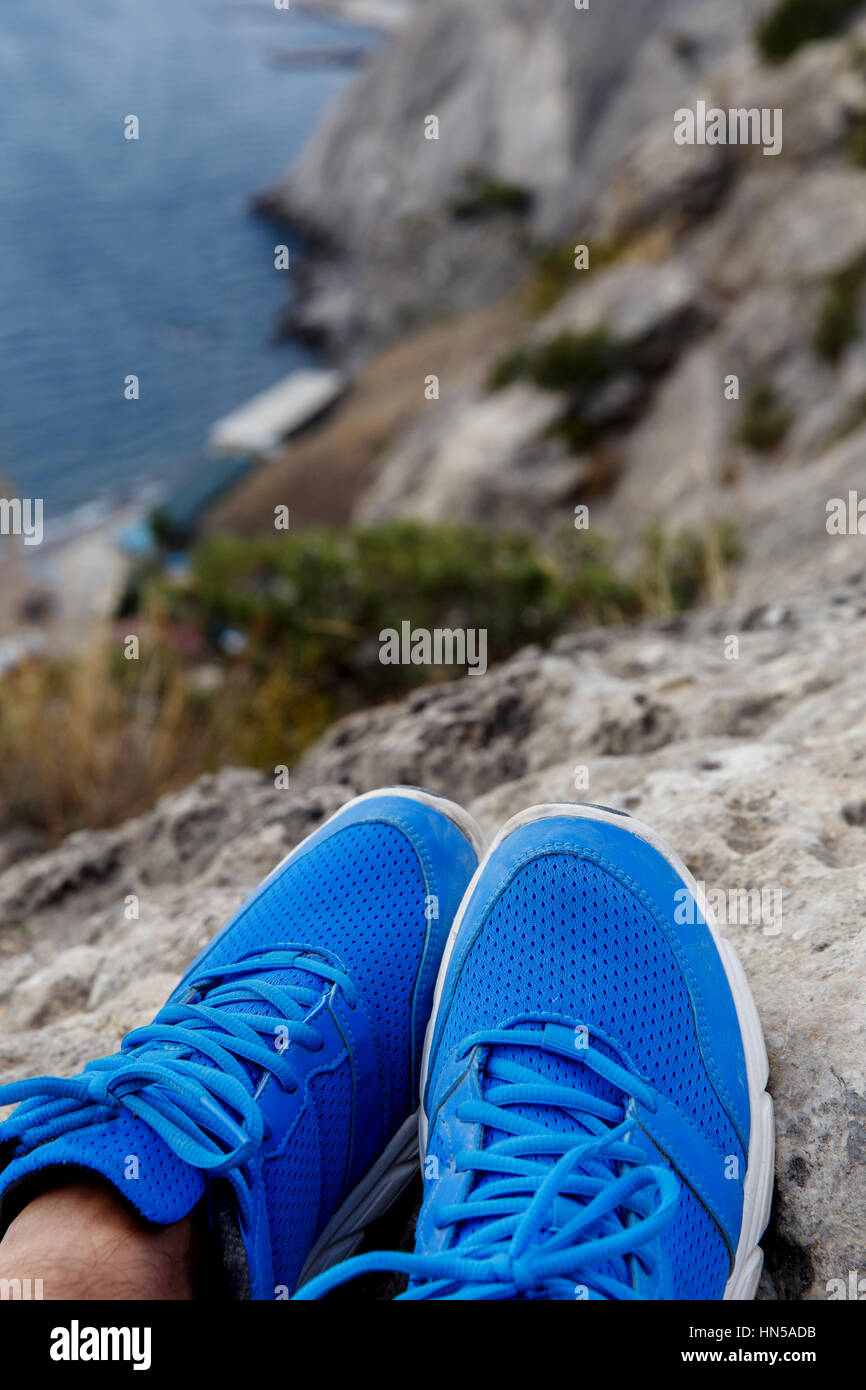 Man in shoes among mountain Stock Photo - Alamy
