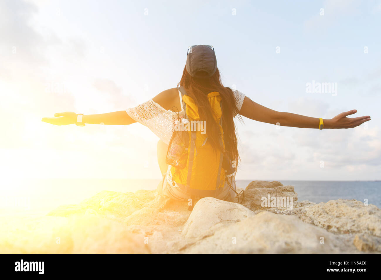 Brunette on sea stone pier Stock Photo - Alamy