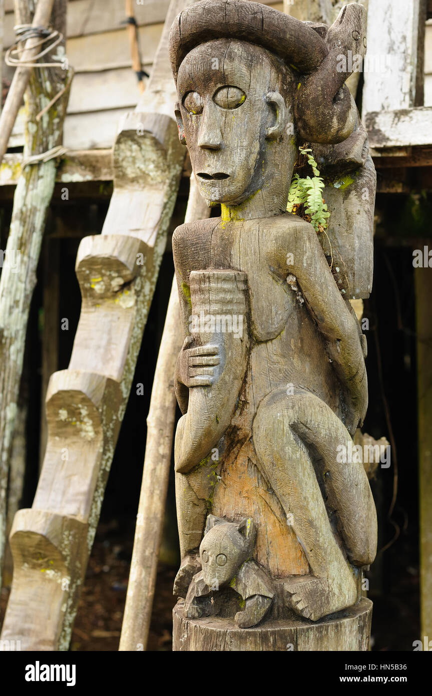Traditional Dayak tribal culture. Detail Dayak (wooden totem) house ...