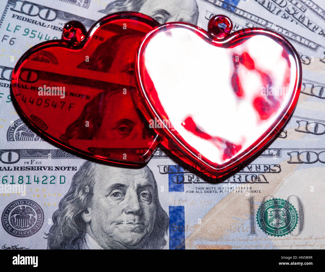 Red heart hundred dollar bills hi-res stock photography and images - Alamy