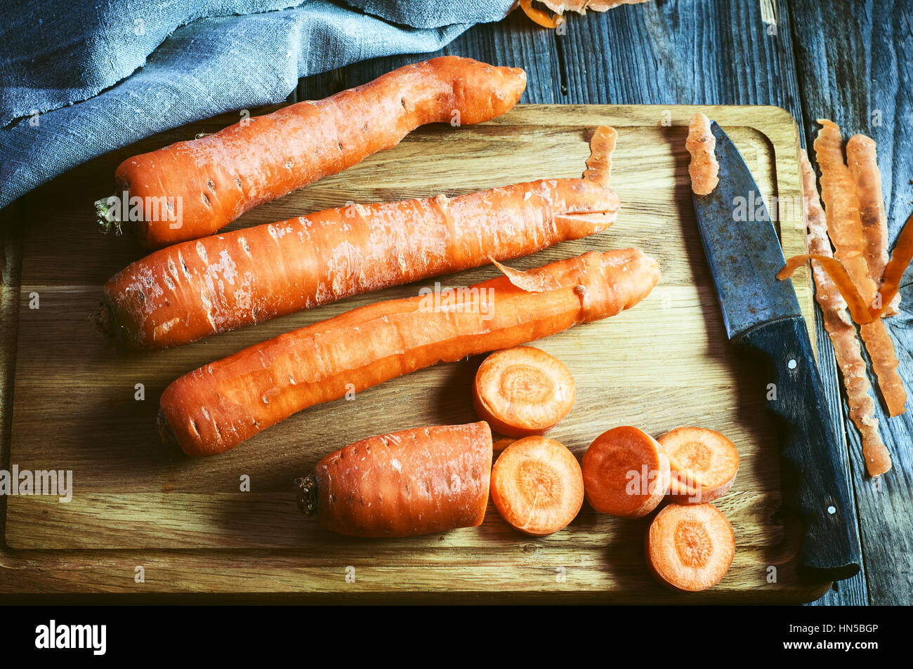 fresh long carrot on a chopping board, top view Stock Photo - Alamy