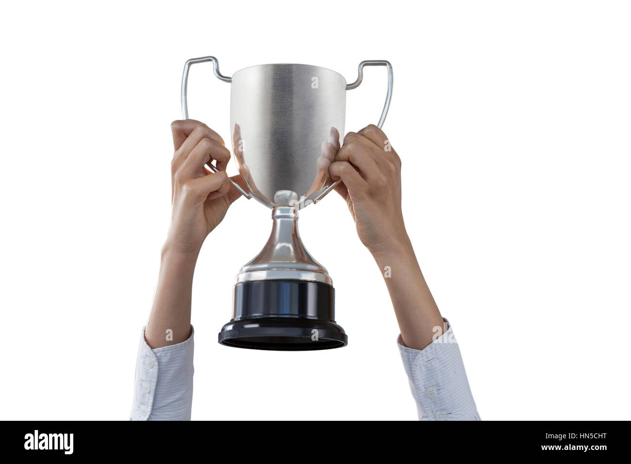 Females hands holding trophy against white background Stock Photo - Alamy