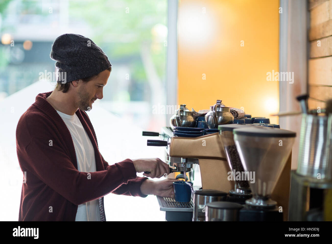 Owner making cup of coffee in espresso machine at cafÃƒÂ© Stock Photo ...
