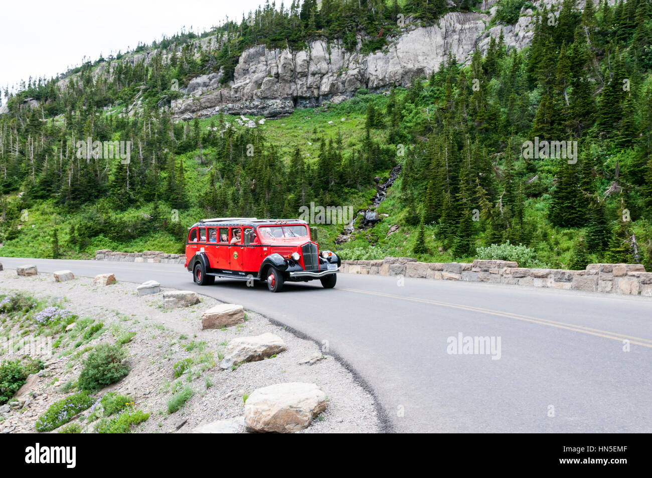 Red bus glacier national park hi-res stock photography and images - Alamy