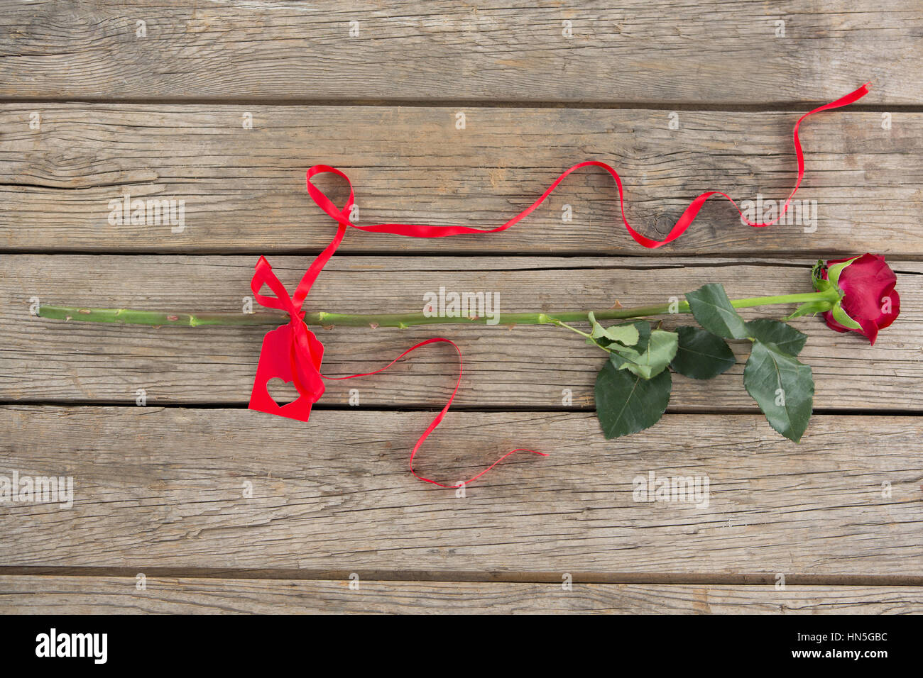 Rose red ribbons hi-res stock photography and images - Alamy