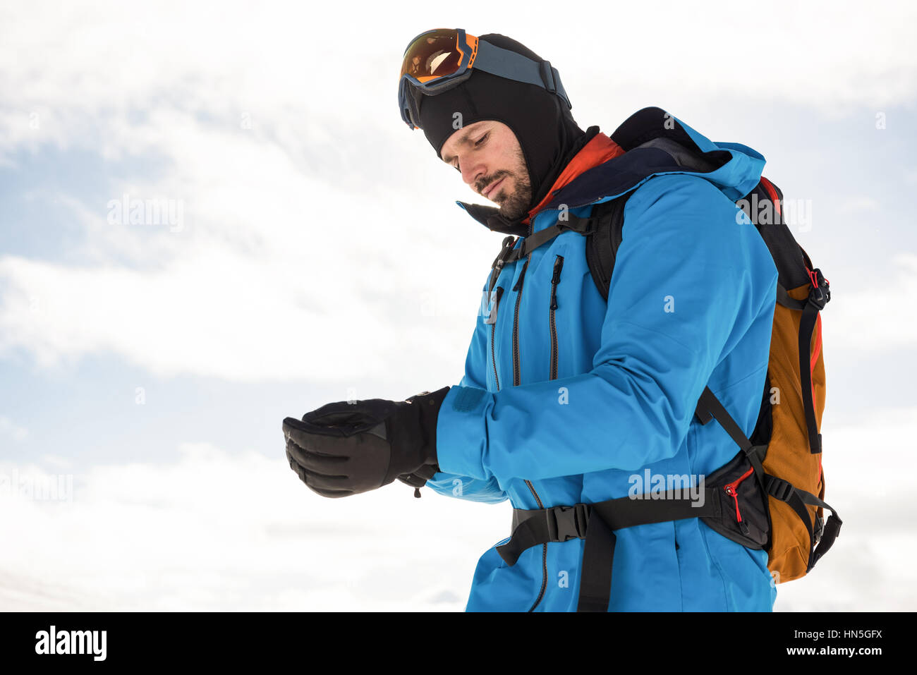 Skier wearing hand gloves hi-res stock photography and images - Alamy