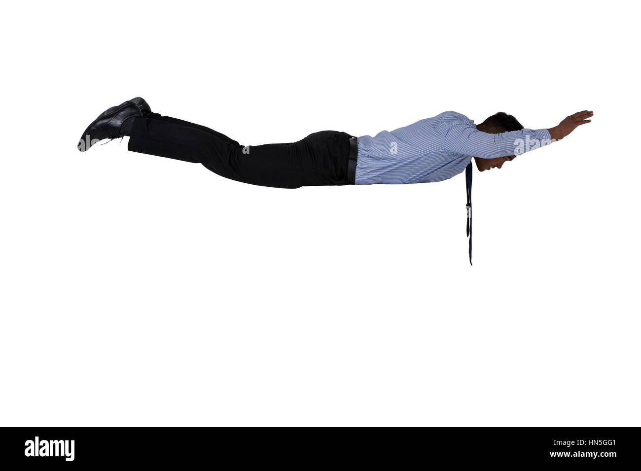 Businessman flying in air against white background Stock Photo - Alamy