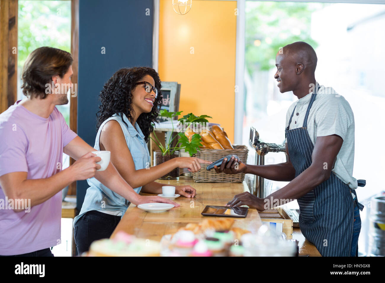 Female customer entering in hi-res stock photography and images - Alamy