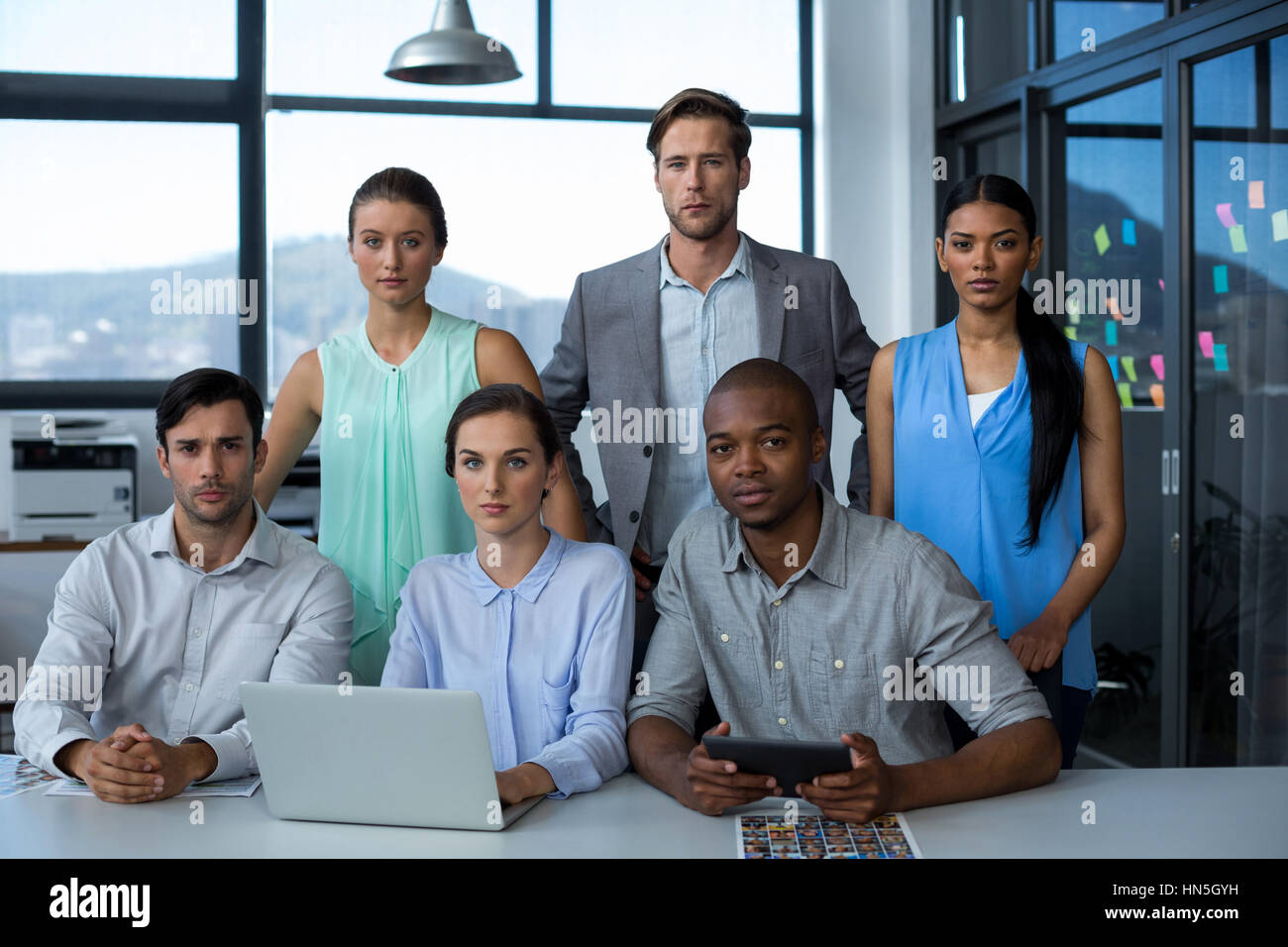 Team of graphic designers working together in office Stock Photo - Alamy