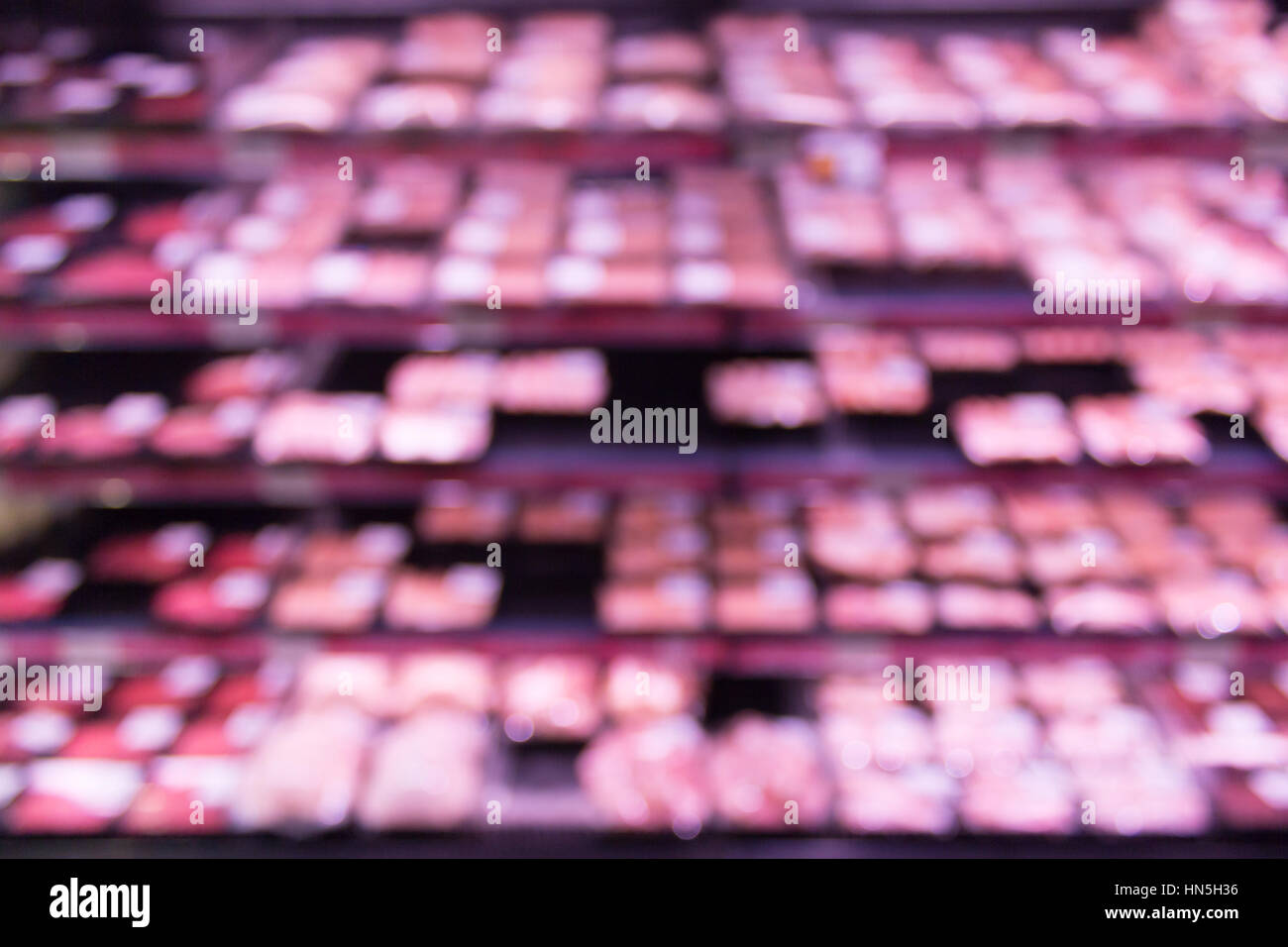 Abstract blur interior meat on shelves at supermarket in shopping mall ...