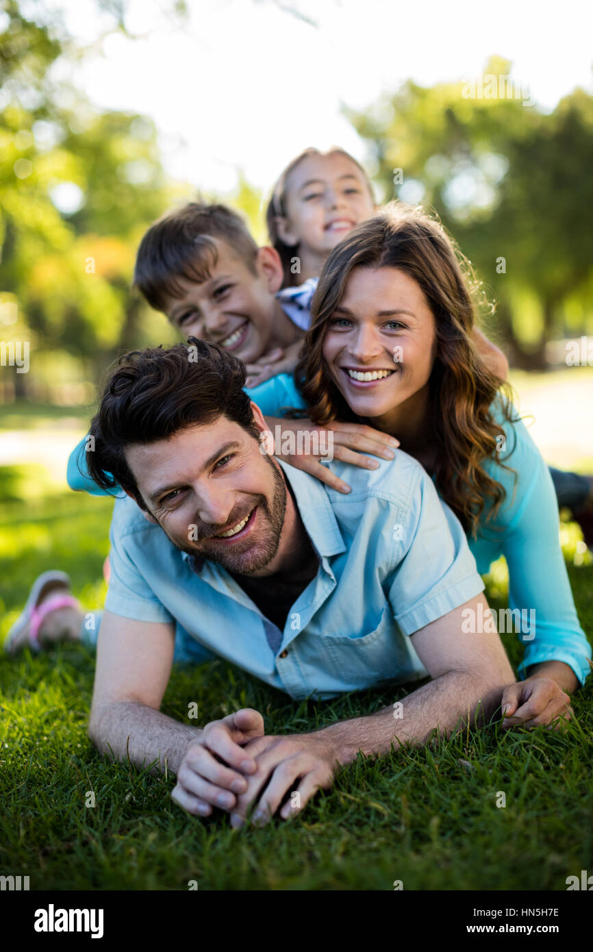 Portrait of happy family playing in park on a sunny day Stock Photo - Alamy