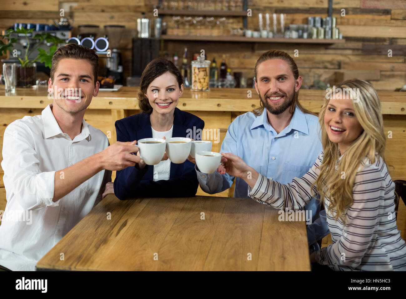 Toasting coffee cups hi-res stock photography and images - Alamy