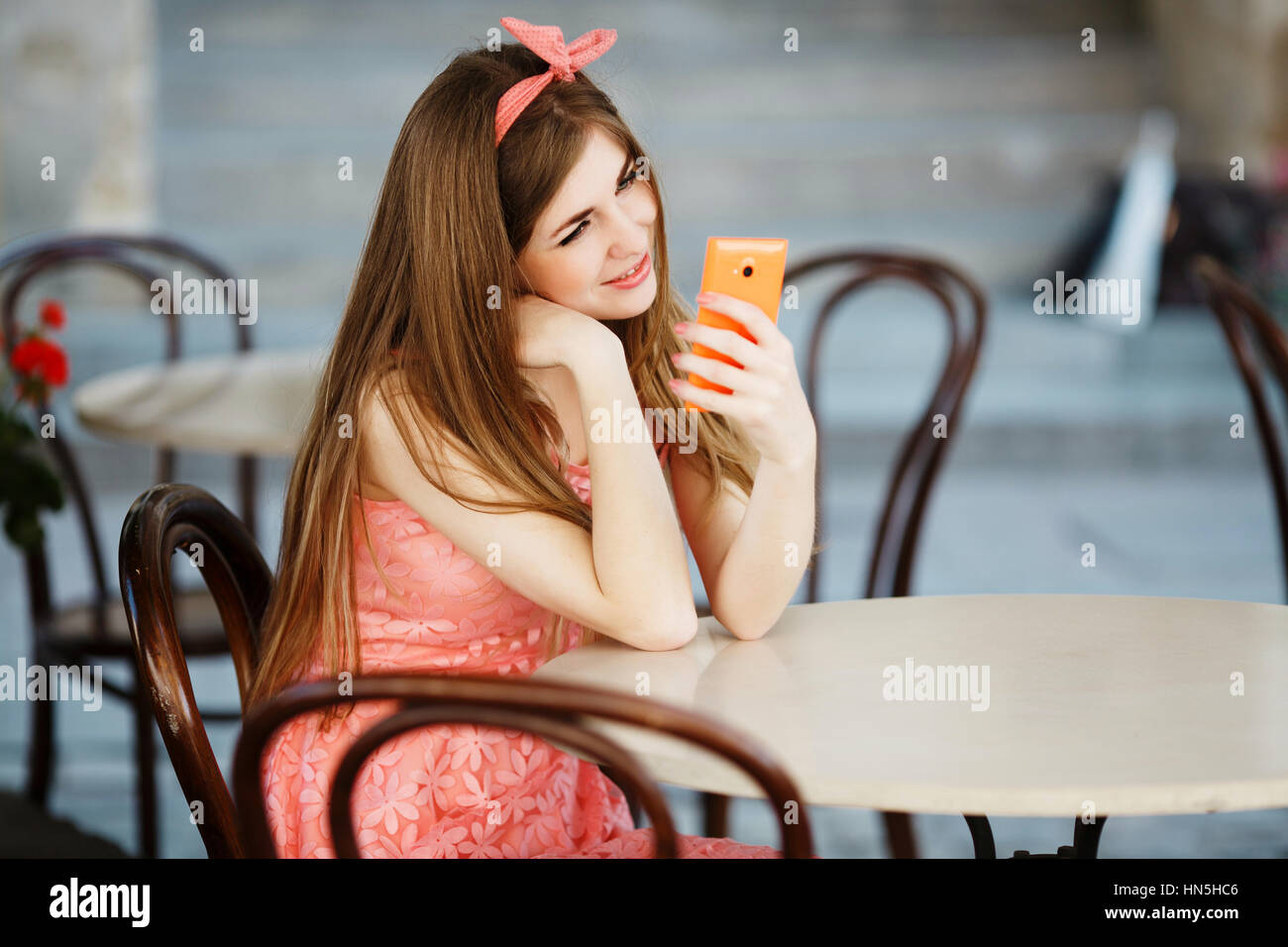 girl looking at mobile phone Stock Photo - Alamy
