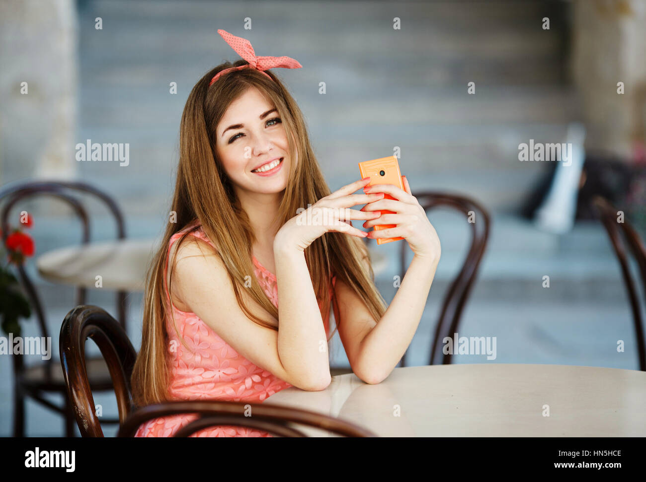 cute girl smiling and looking at the camera Stock Photo - Alamy