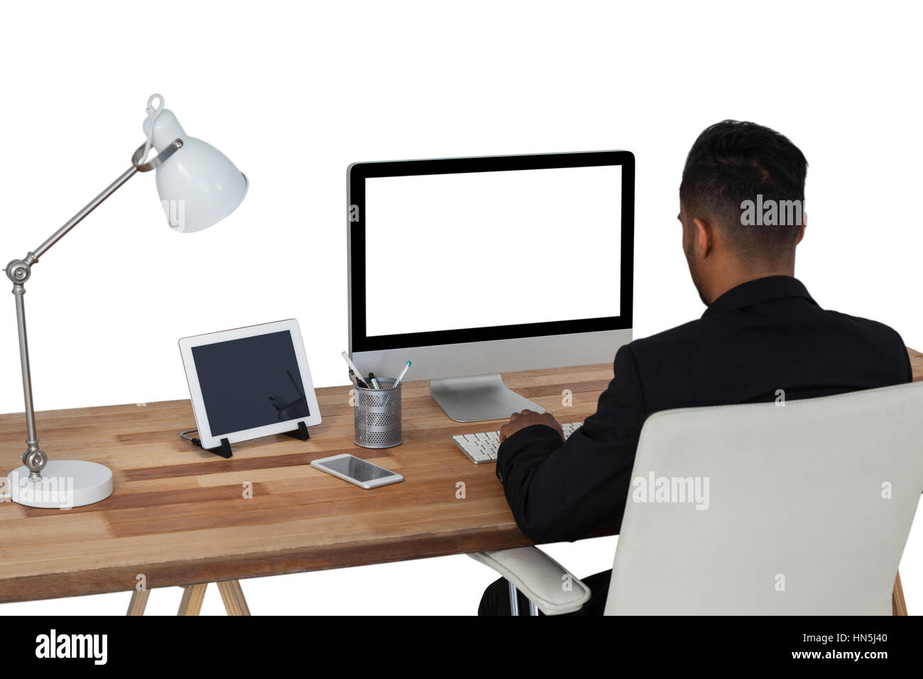 Businessman working over computer against white background Stock Photo ...