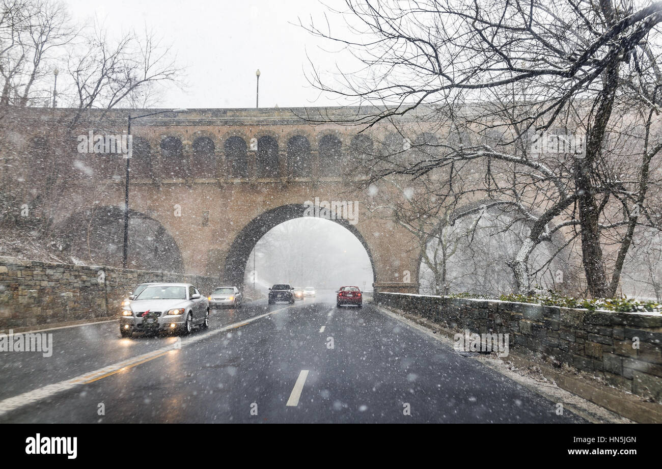 Washington DC, USA - January 7, 2017: Winter snow storm on road with ...