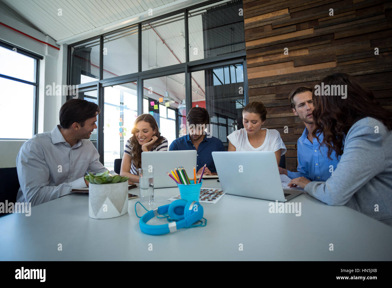 Team of graphic designers working together in office Stock Photo - Alamy