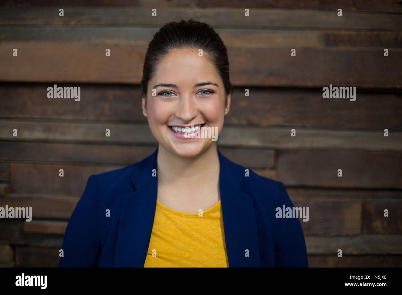 Portrait of smiling female business executive standing in office Stock ...