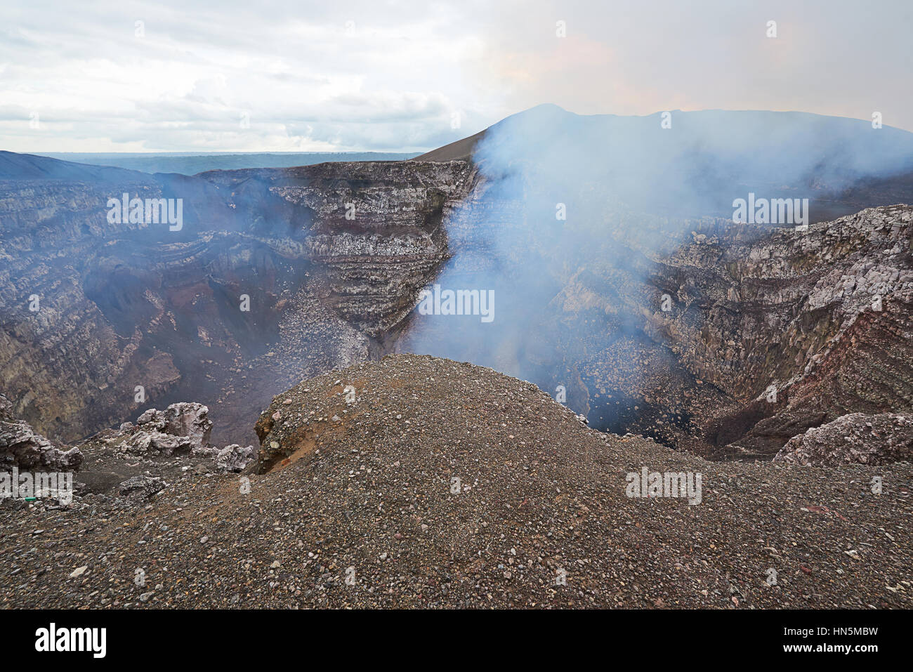wide volcano crater with smoke in masaya nicaragua Stock Photo - Alamy