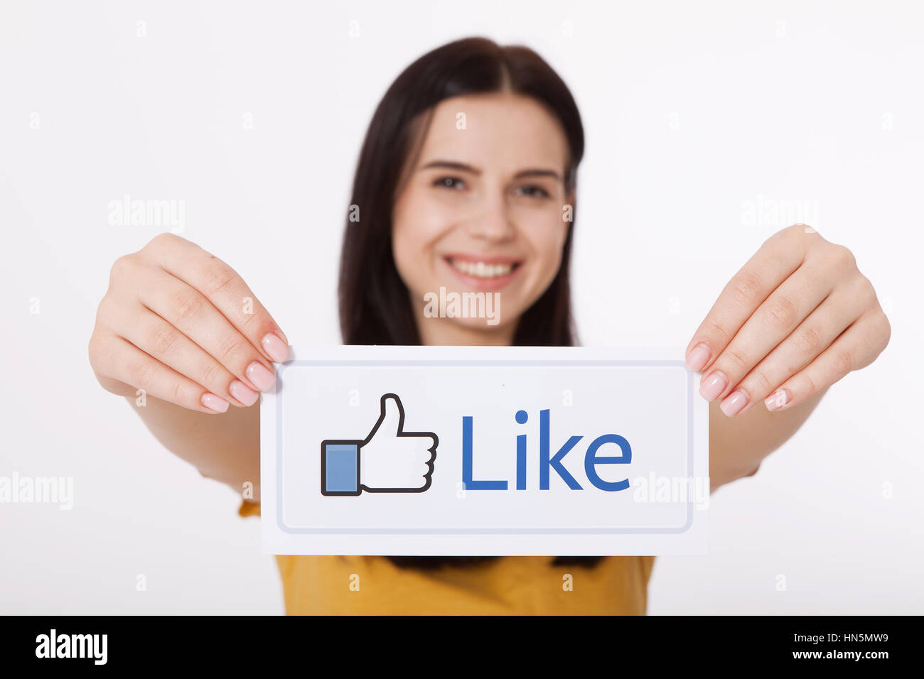 KIEV, UKRAINE - August 22, 2016: Woman hands holding facebook thumbs up ...