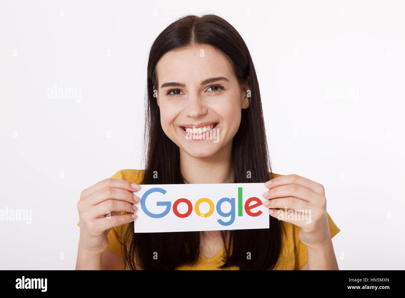 Kiev, Ukraine - August 22, 2016: Woman hands holding Google logotype ...