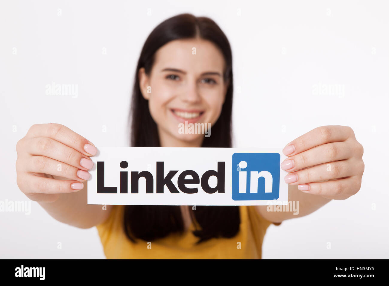 KIEV, UKRAINE - August 22, 2016: Woman hands holding Linkedin logo sign ...