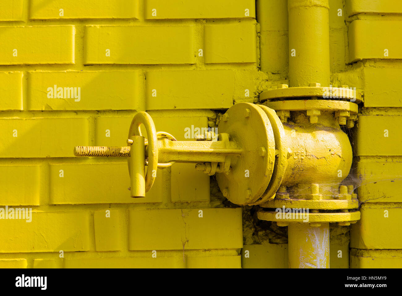 Street yellow gas pipe with valve Stock Photo - Alamy