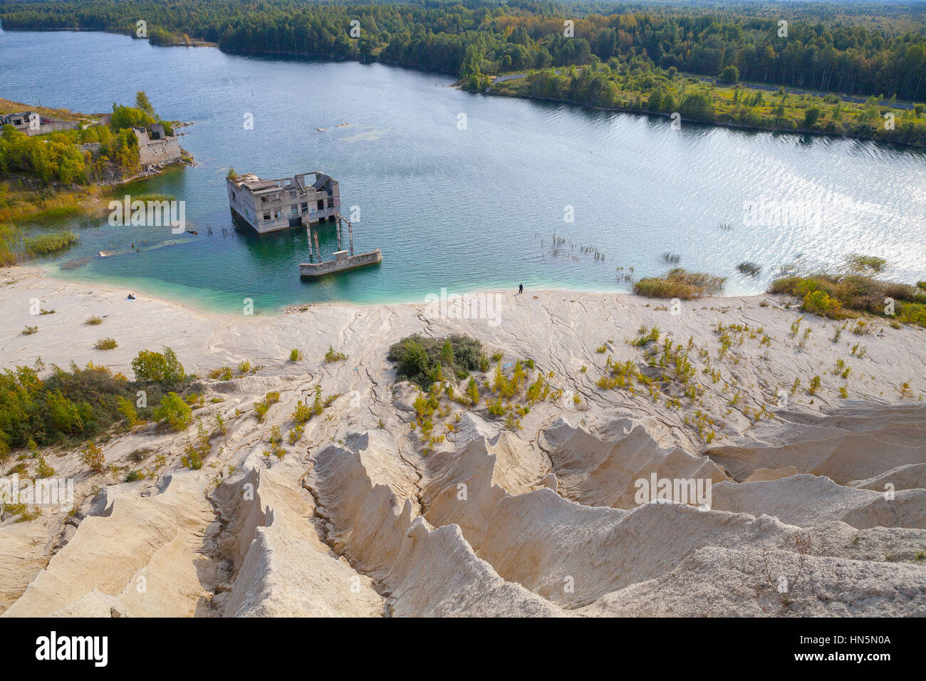 Sand quarry with a pond and abandoned prison in Rummu, Estonia Stock ...