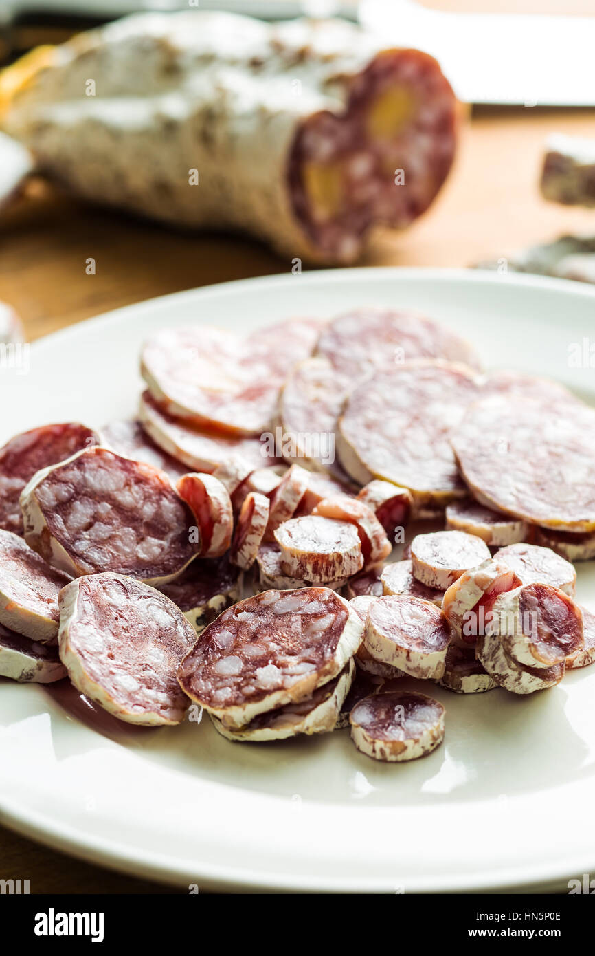 Tasty sliced salami with white mold Stock Photo - Alamy