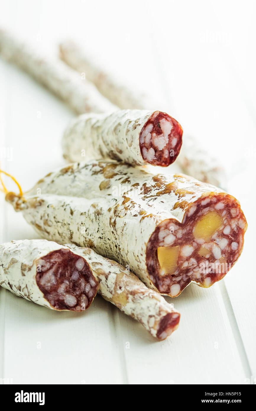 Tasty sliced salami with white mold Stock Photo - Alamy