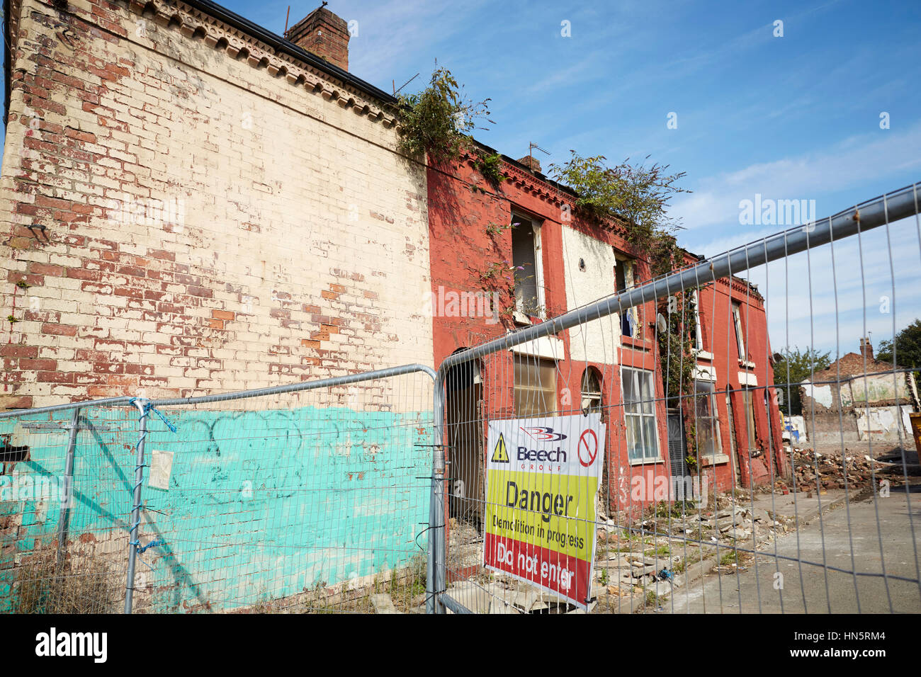fenced off warning keep out sign derelict condemned empty houses ...
