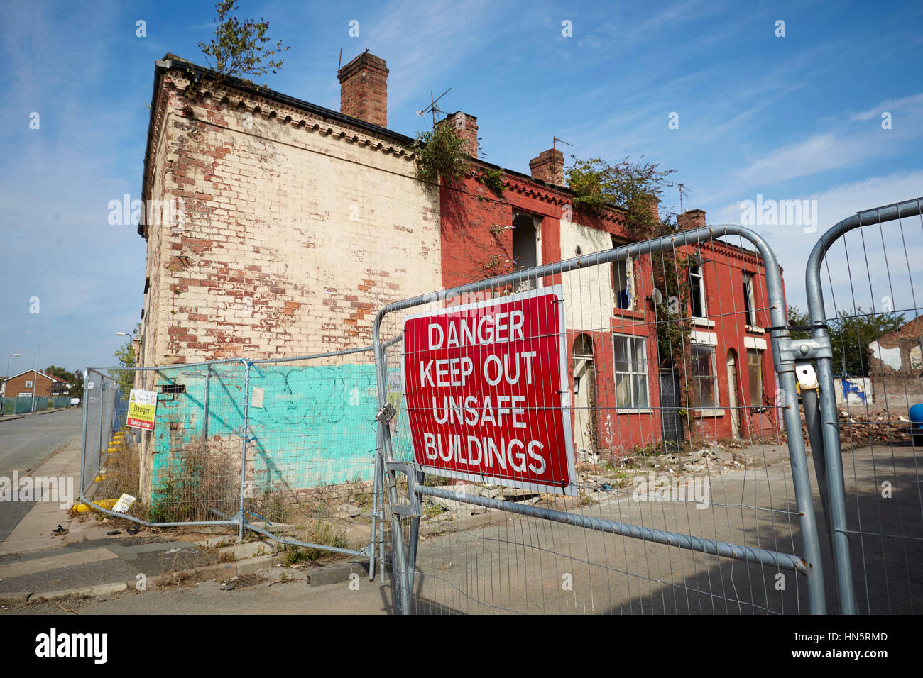 fenced off warning keep out sign derelict condemned empty houses ...