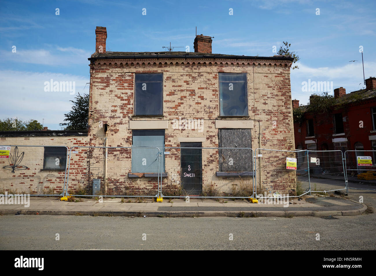 fenced off warning keep out sign derelict condemned empty houses ...