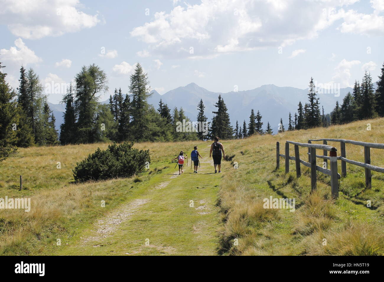 people walk on a path in the mountains Stock Photo - Alamy
