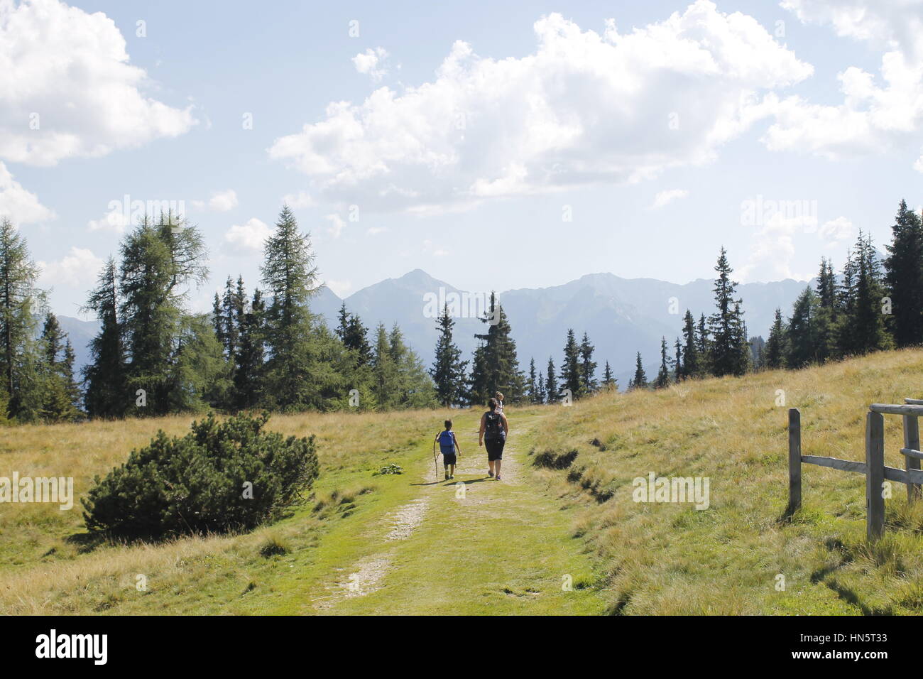 people walk on a path in the mountains Stock Photo - Alamy