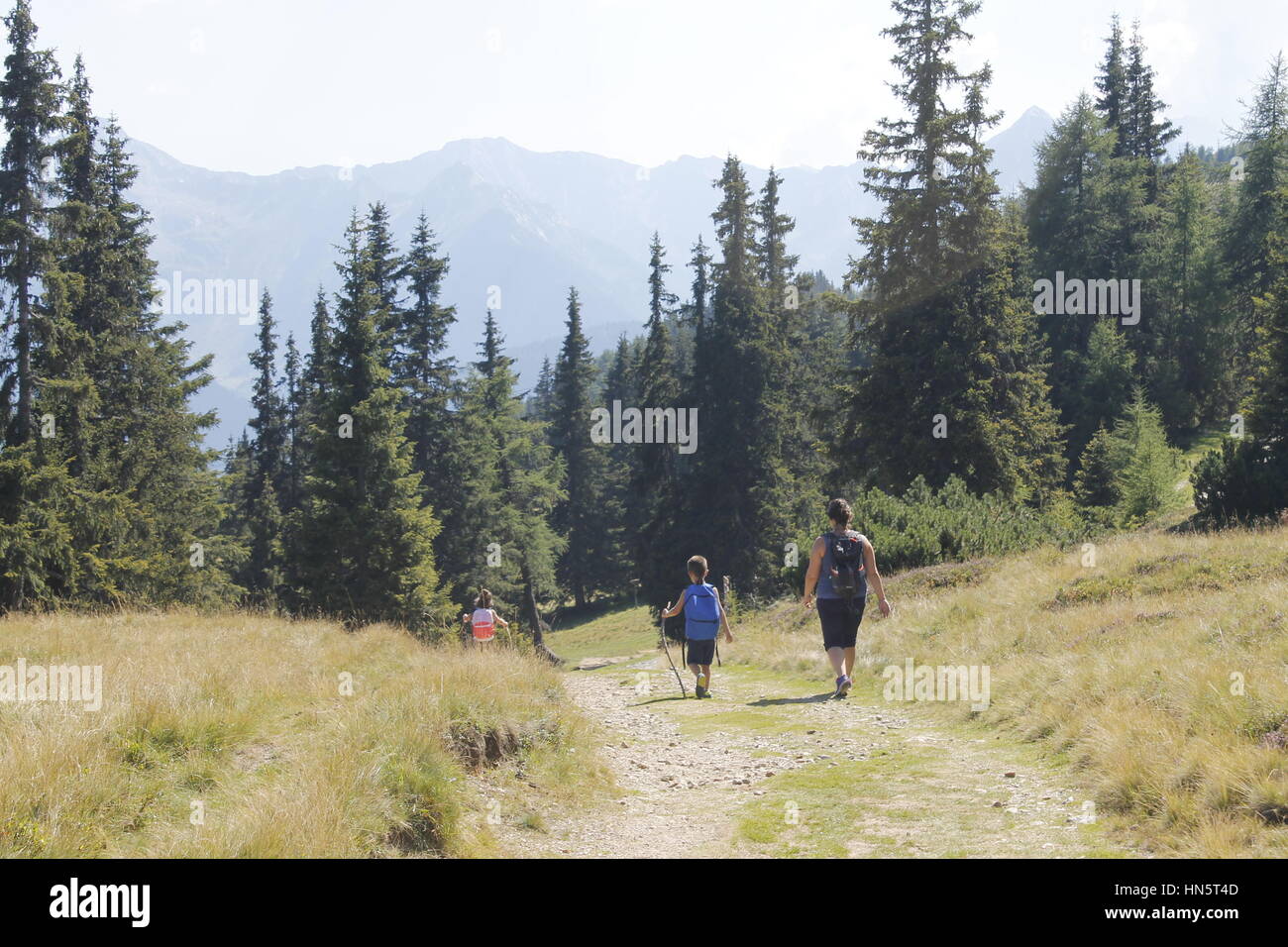 people walk on a path in the mountains Stock Photo - Alamy