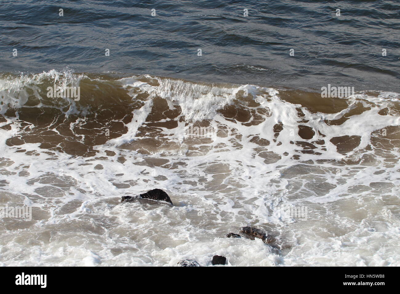 Tidal shoreline waves hi-res stock photography and images - Alamy