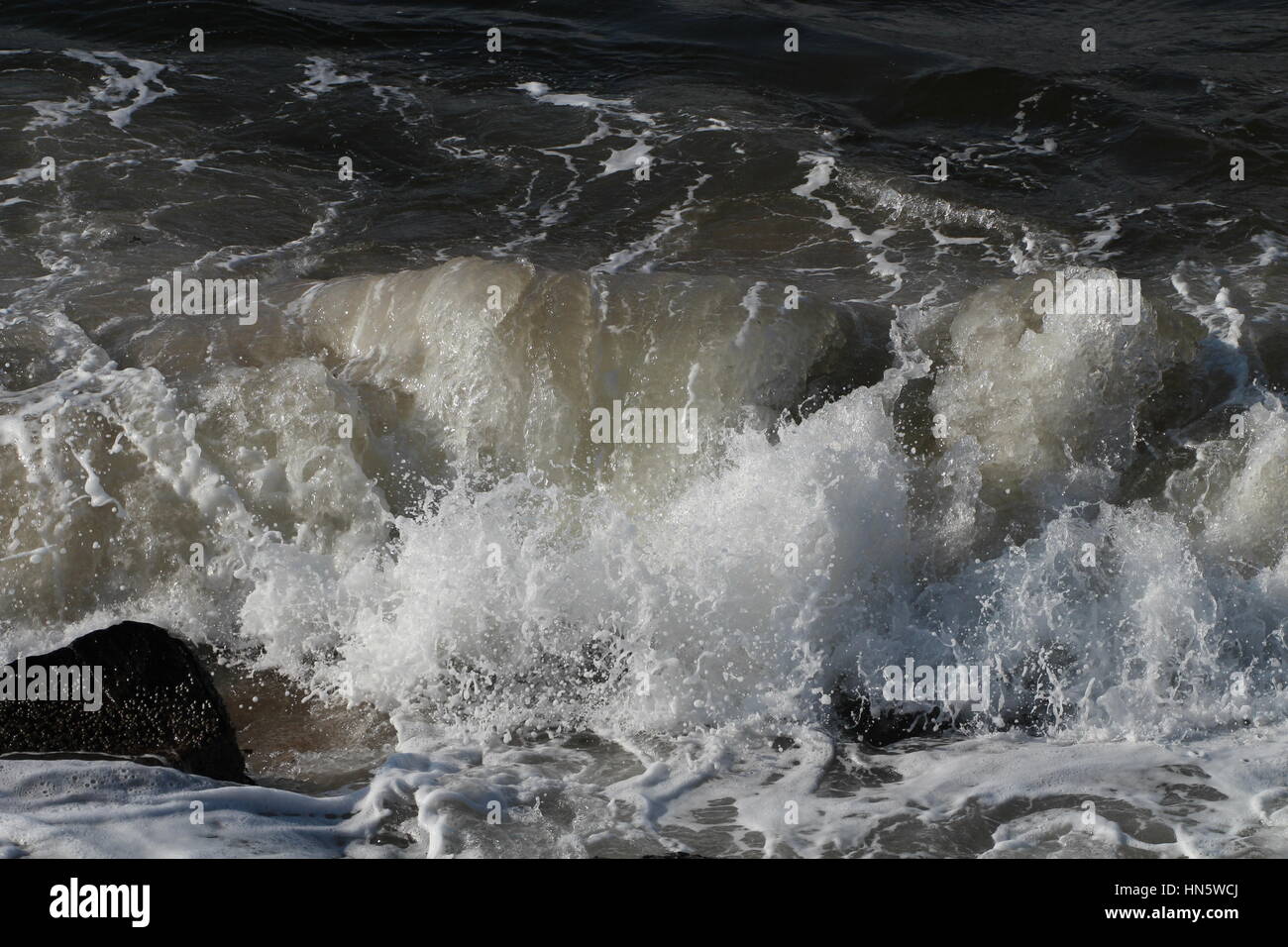 Waves breaking on a rocky shoreline Stock Photo - Alamy