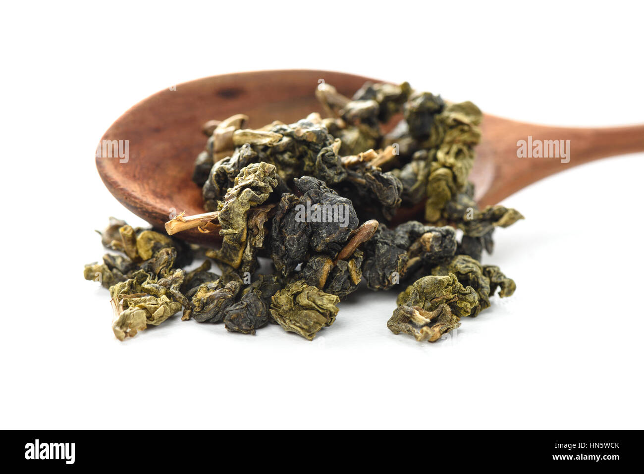 dried green tea leaf isolated on white background Stock Photo - Alamy
