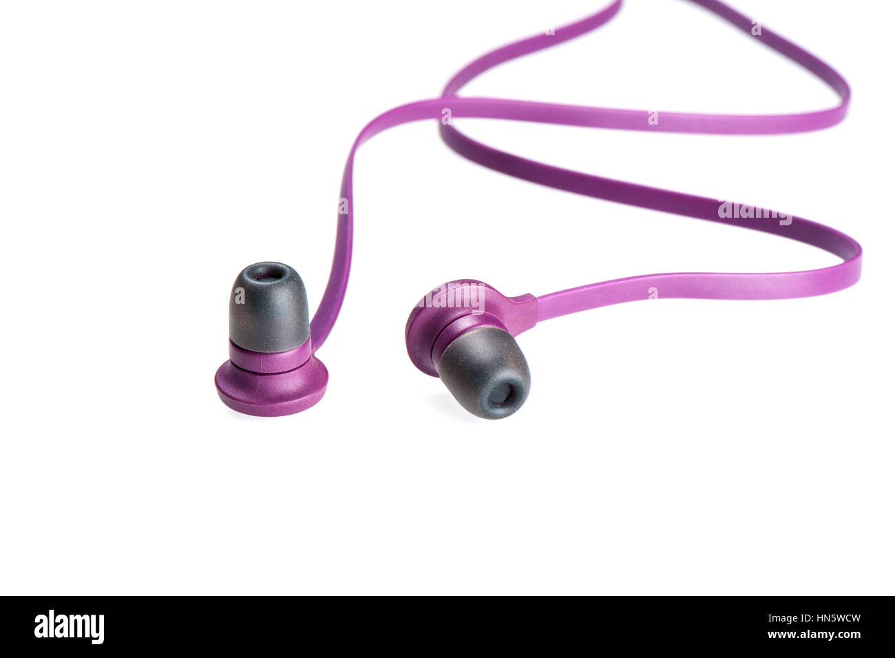 a Pair of purple earphones on white background Stock Photo - Alamy