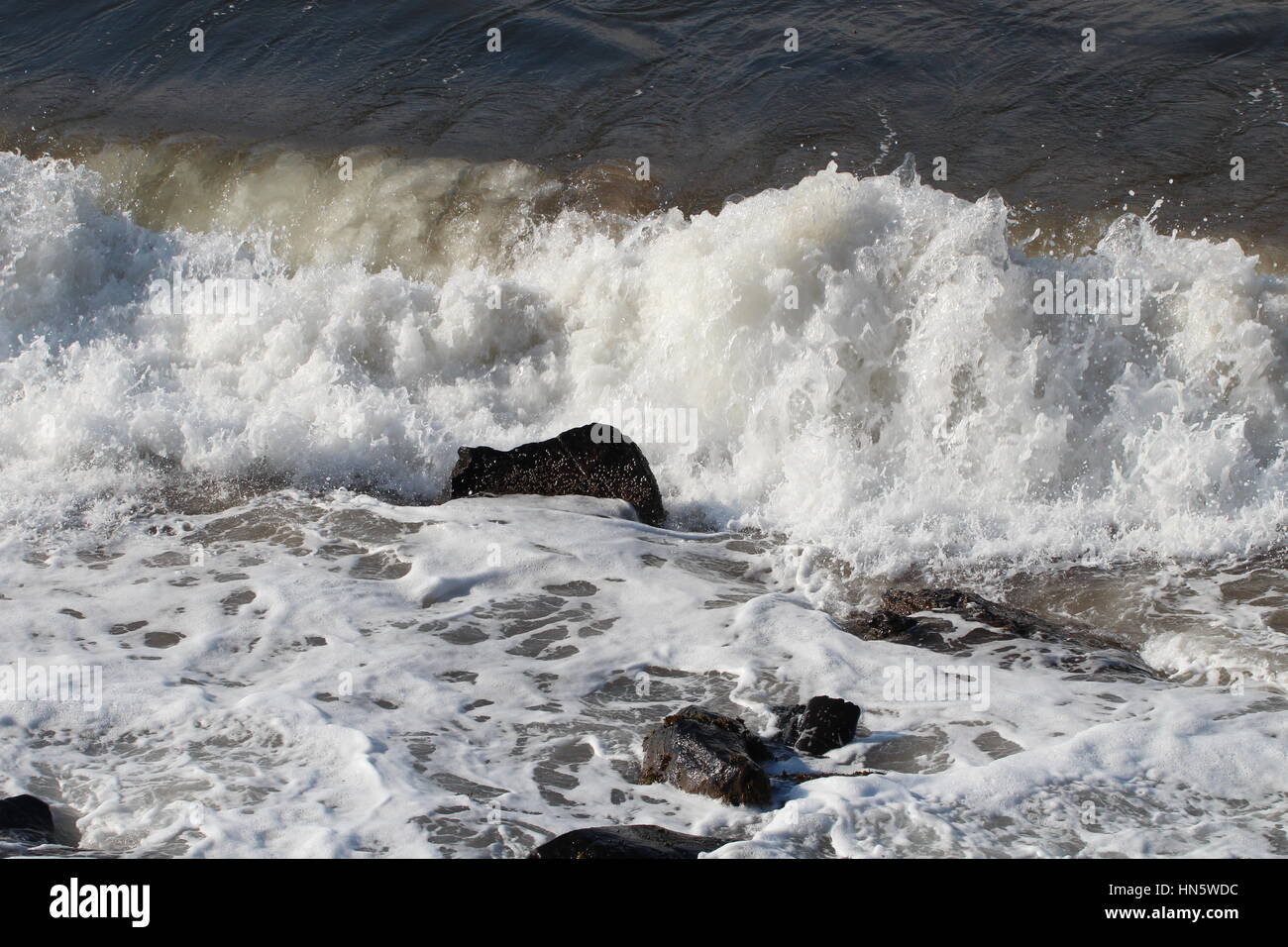 Waves breaking on a rocky shoreline Stock Photo - Alamy