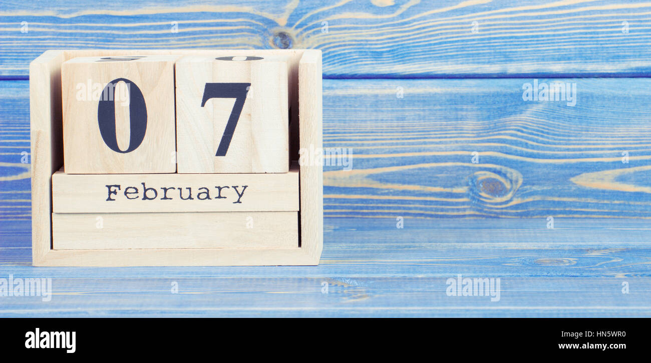 Vintage photo, February 7th. Date of 7 February on wooden cube calendar, copy space for text on ...
