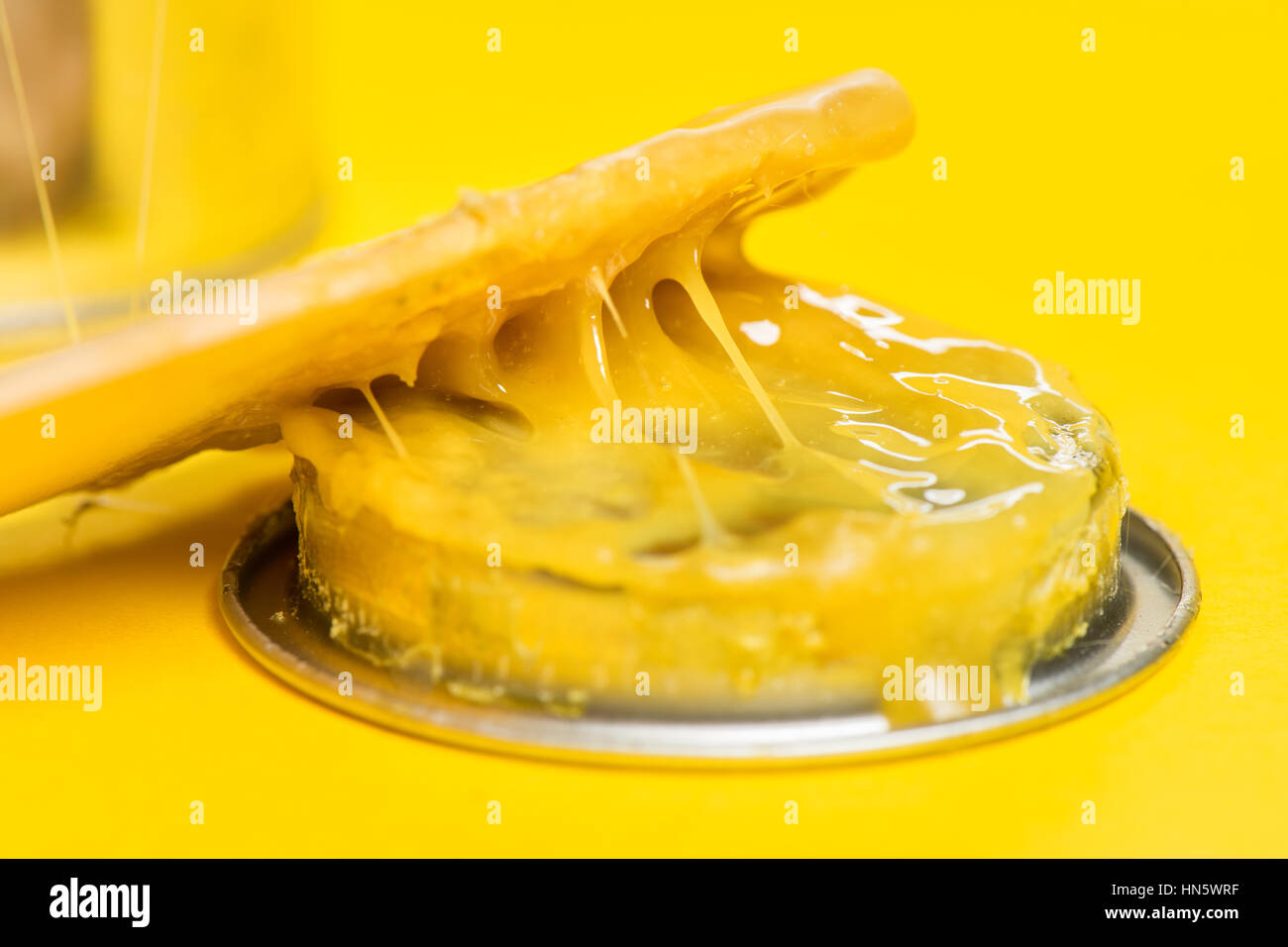 closeup rubber adhesive on yellow background Stock Photo - Alamy