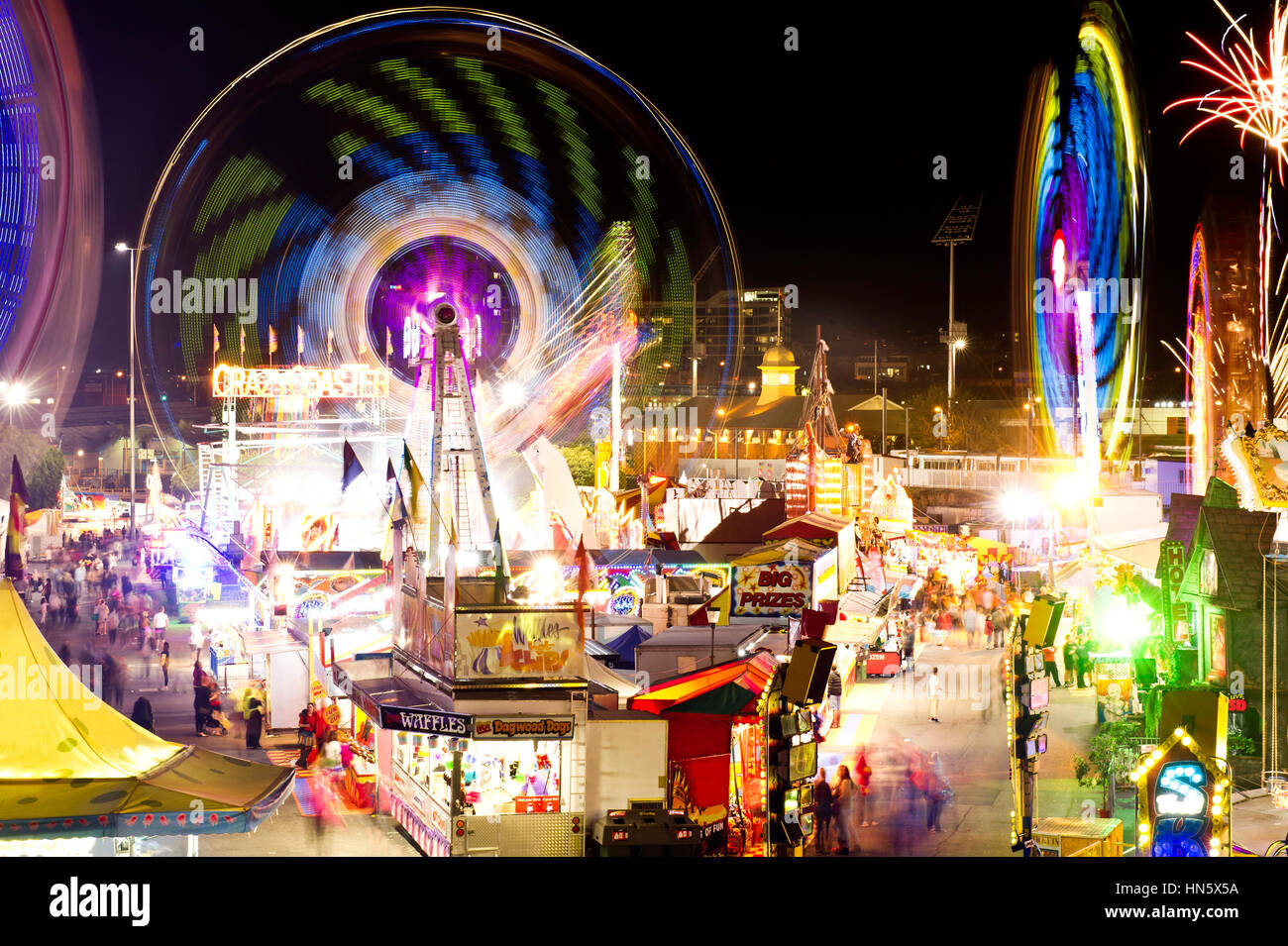 Fairground carnival rides at night time Stock Photo - Alamy