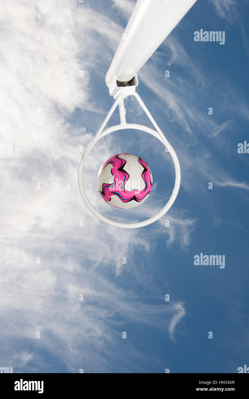 Netball going through the goal post Stock Photo - Alamy