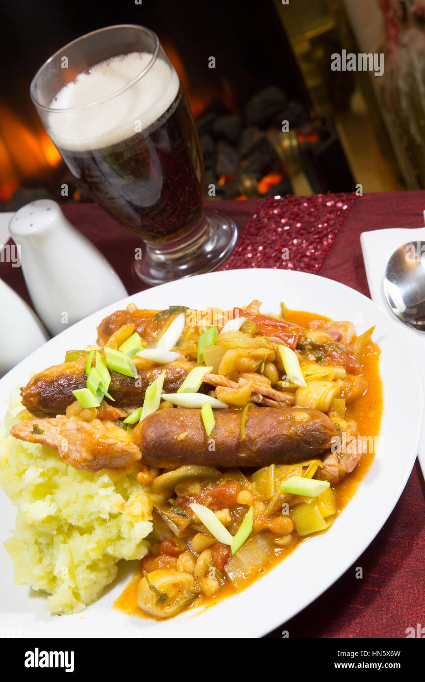 A plate of curry flavoured Sausage Hash with creamed potatoes Stock ...