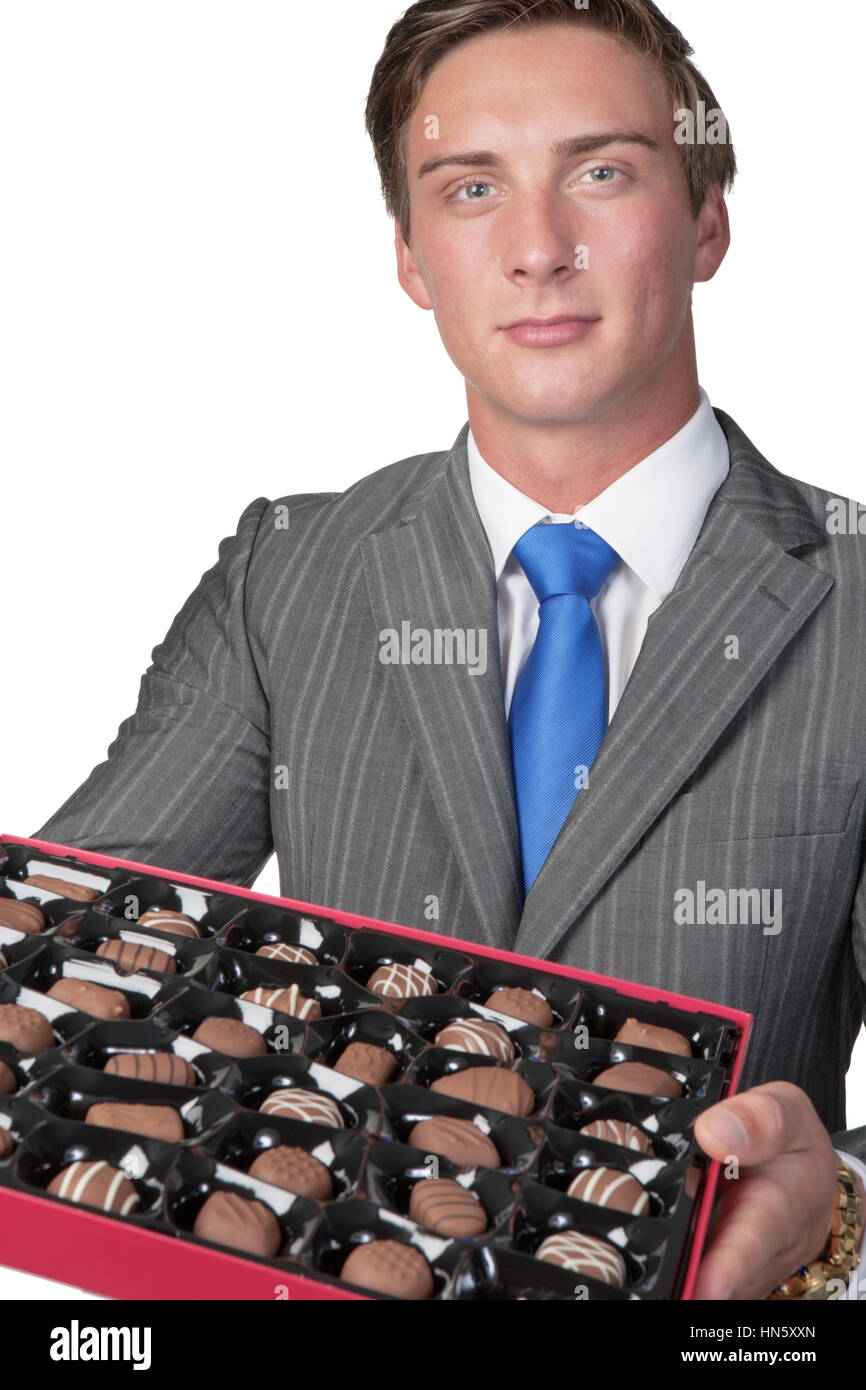 Man eating chocolates hi-res stock photography and images - Alamy